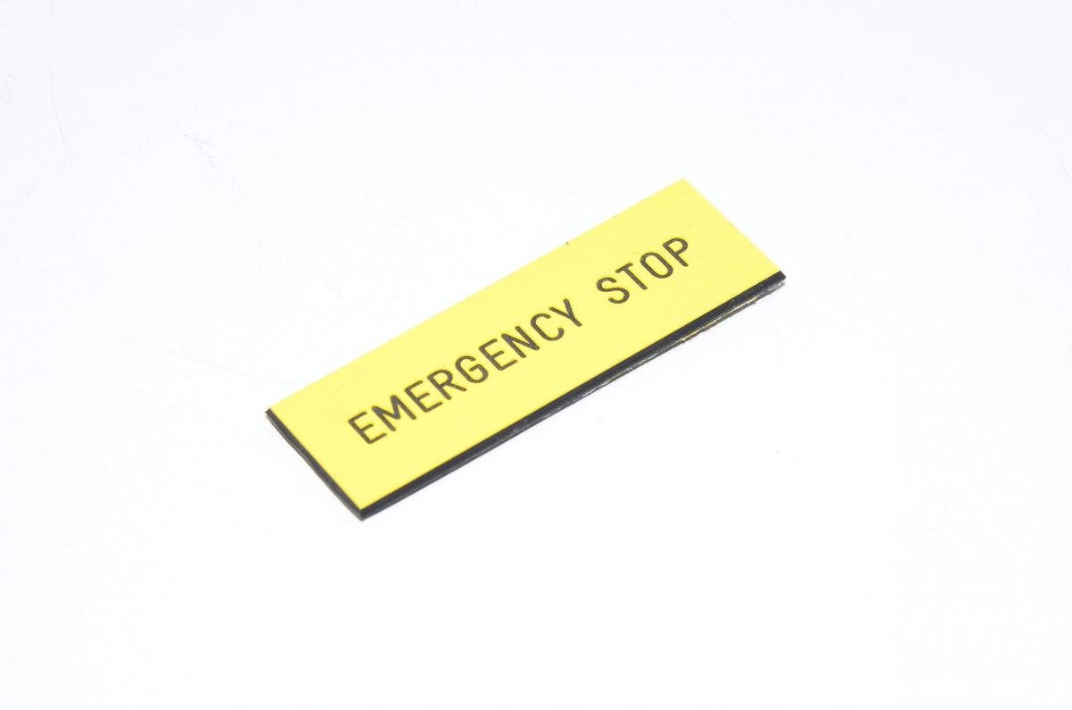 Legend plate, yellow, 60,5x20mm rectangular, "EMERGENCY STOP"